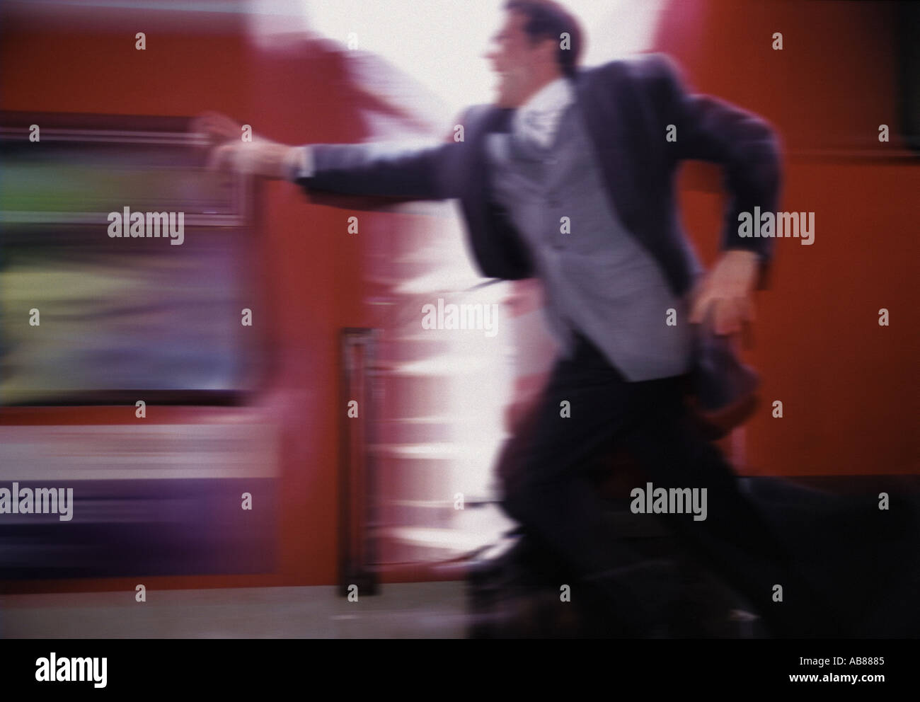 Man running after train hi-res stock photography and images - Alamy