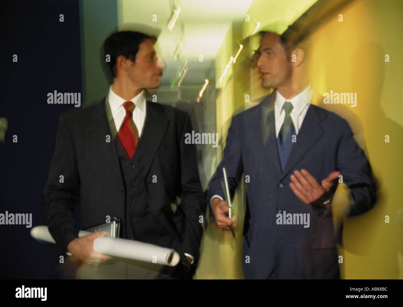 Two businessmen folder talking hi-res stock photography and images - Alamy