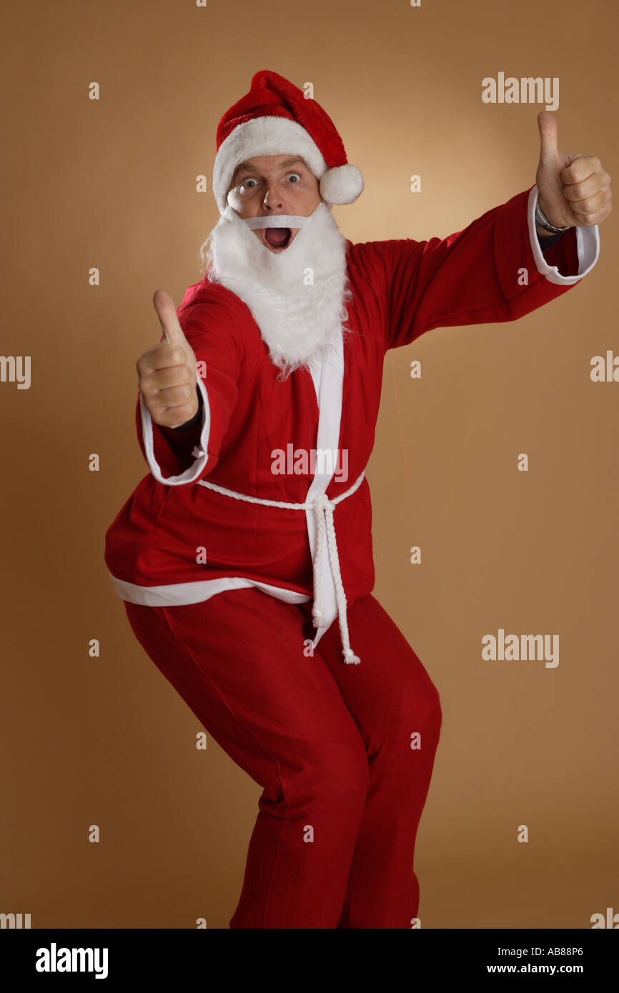 portrait of a costumed Santa Claus, making the o.k.-sign Stock Photo ...