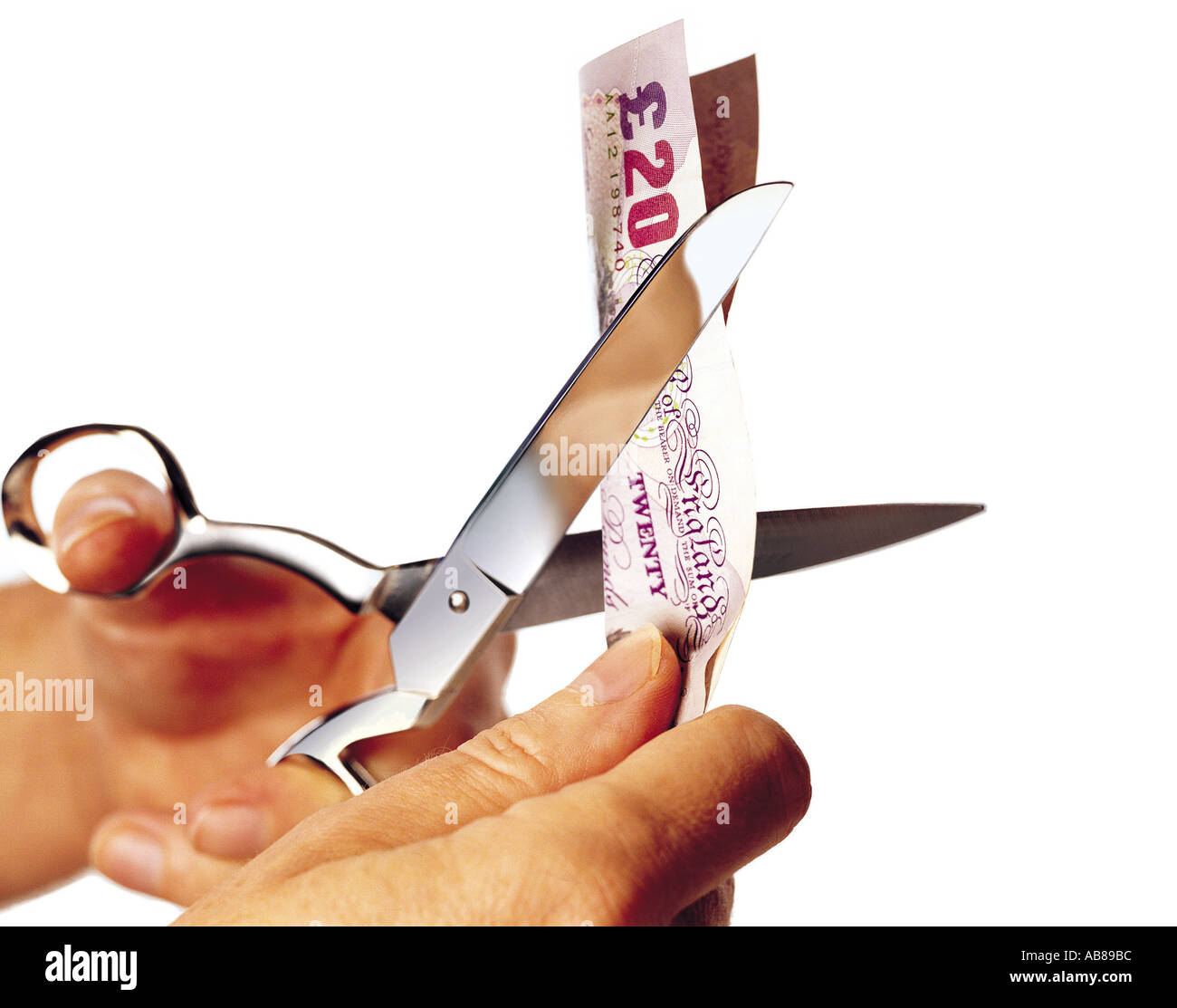 Person cutting a banknote with scissors Stock Photo - Alamy