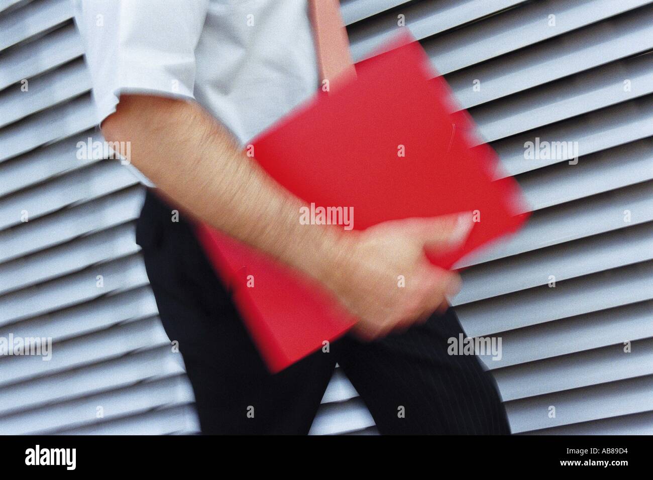 Man carrying file Stock Photo - Alamy