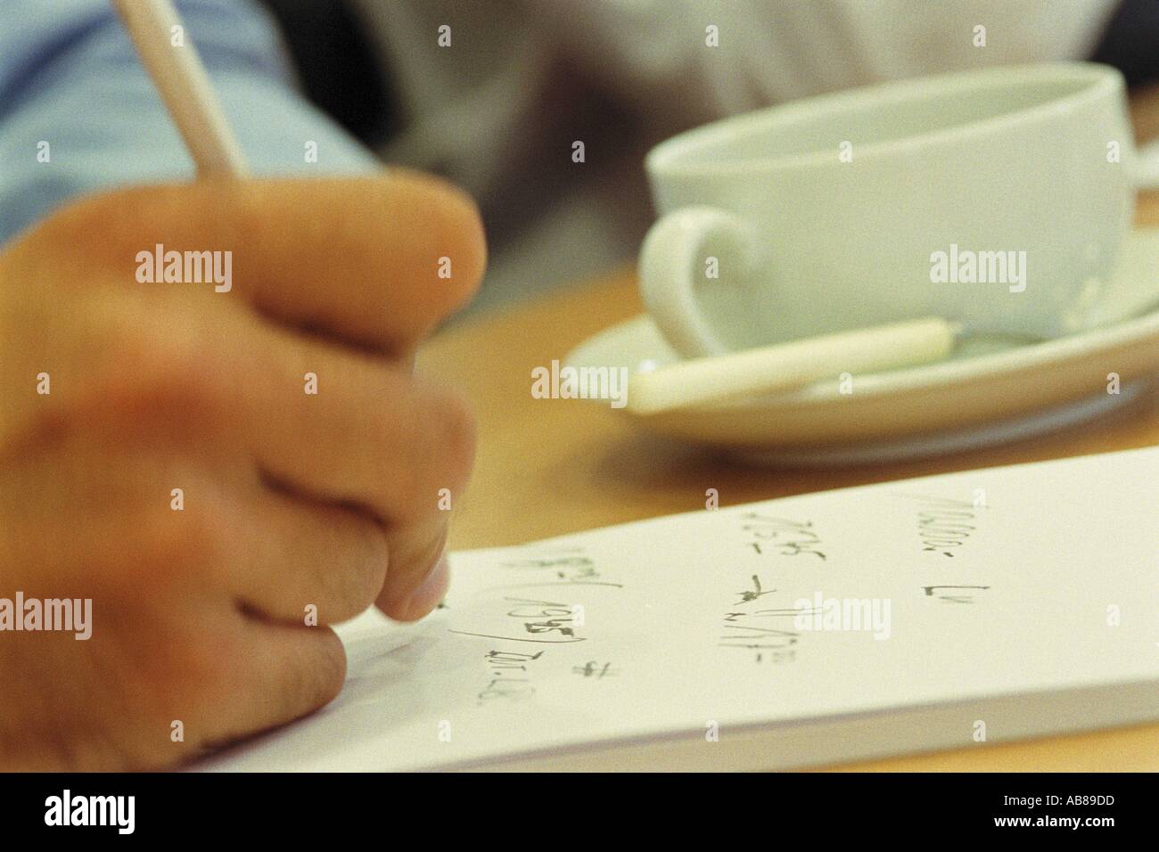 Person taking notes Stock Photo - Alamy