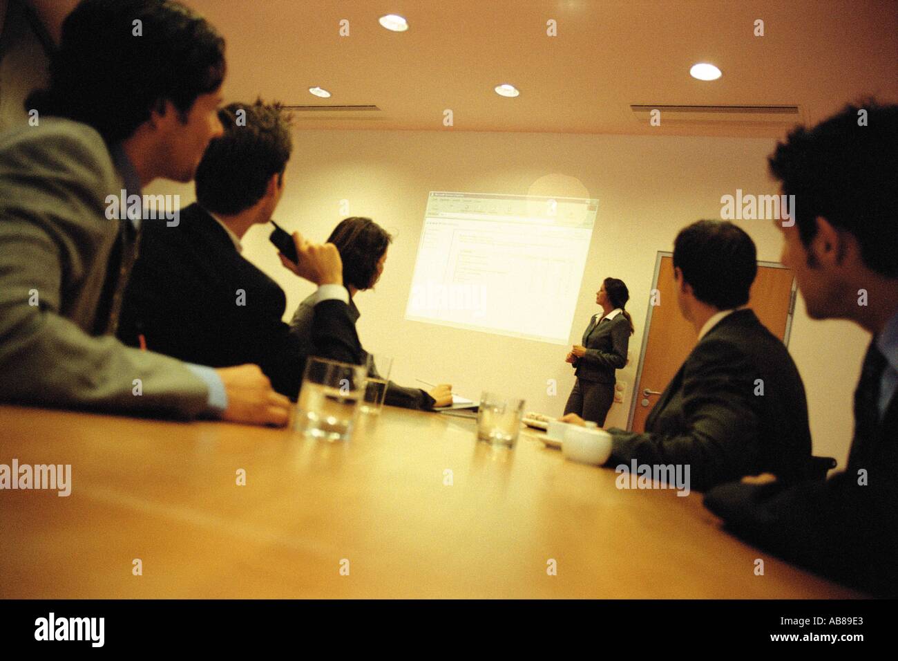 Businesspeople watch presentation hi-res stock photography and images ...