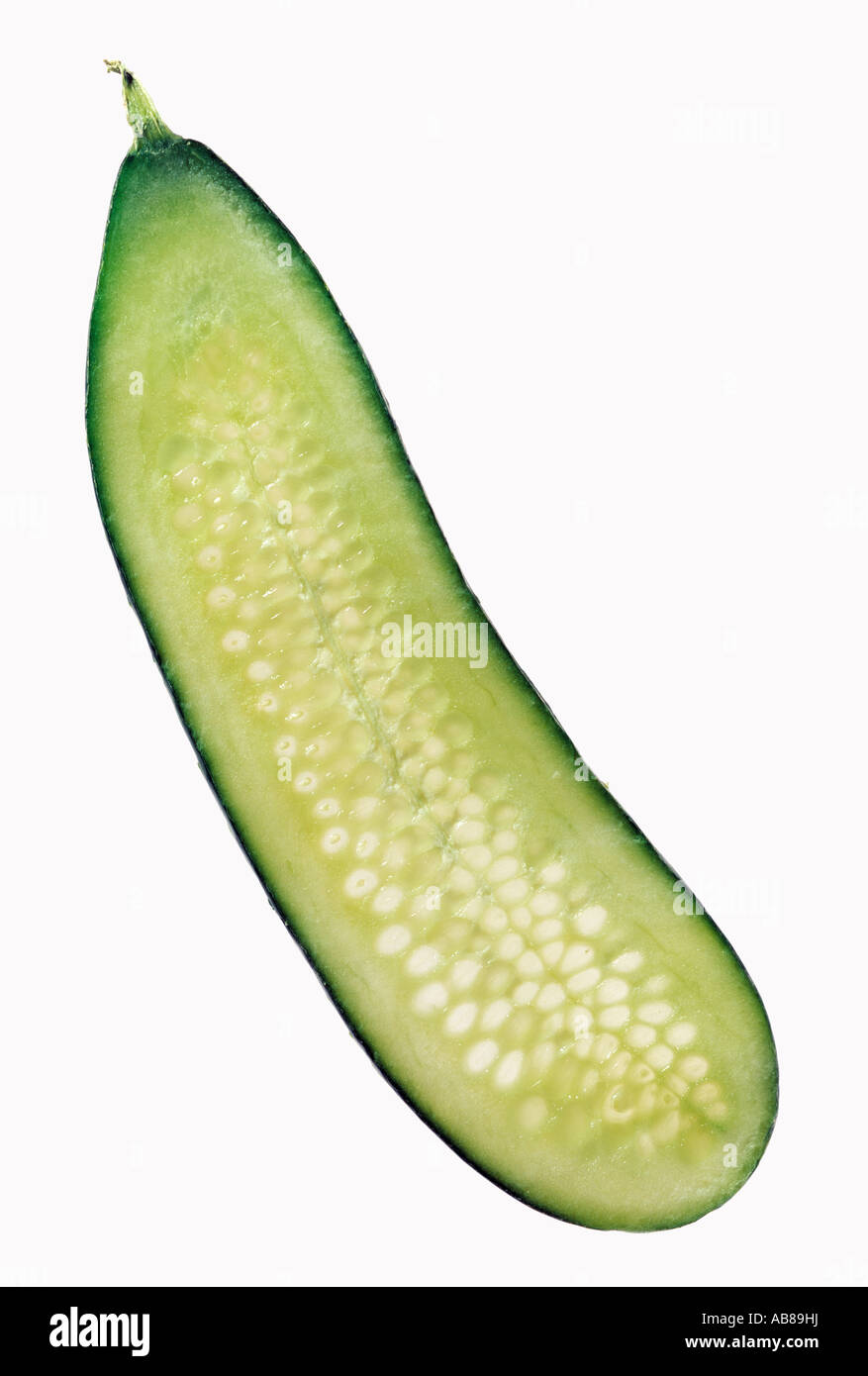 Cucumber sliced lengthways on a white background Stock Photo - Alamy