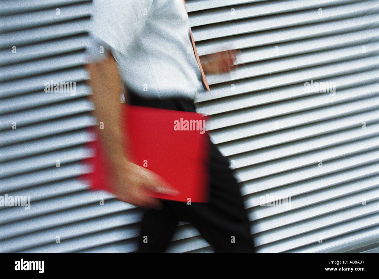 Man carrying file Stock Photo - Alamy