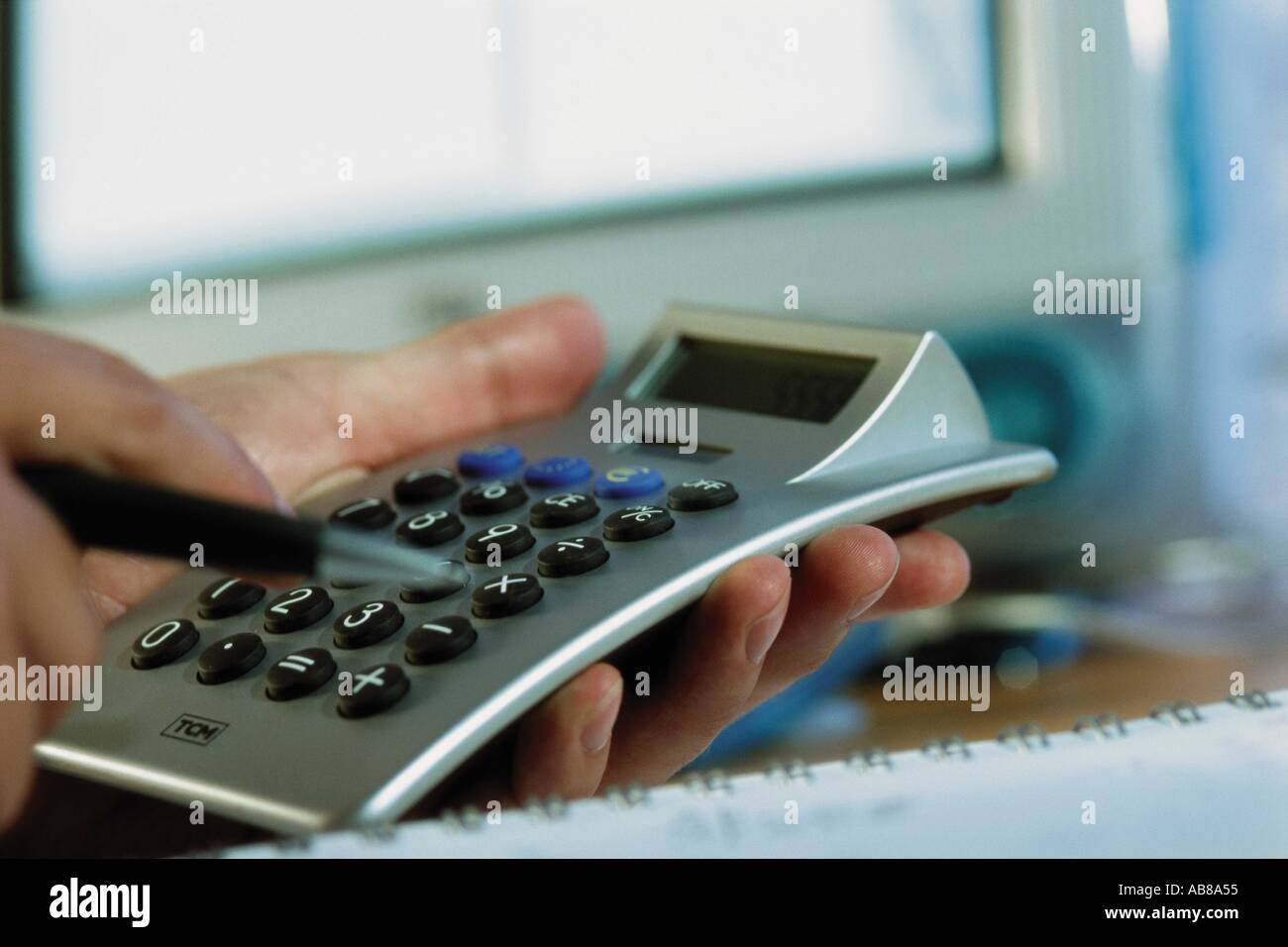 Person using calculator Stock Photo - Alamy