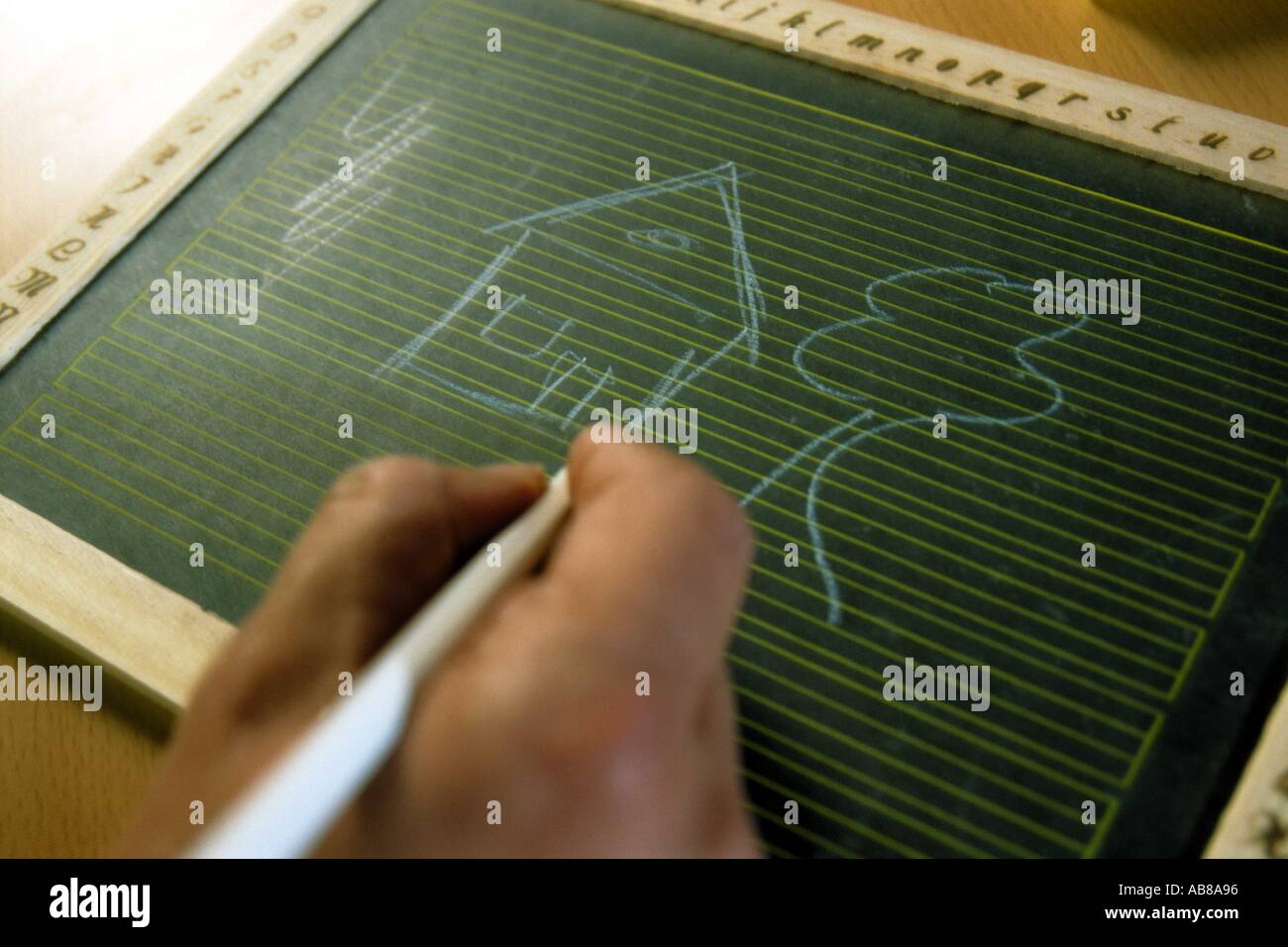Person drawing on blackboard Stock Photo - Alamy