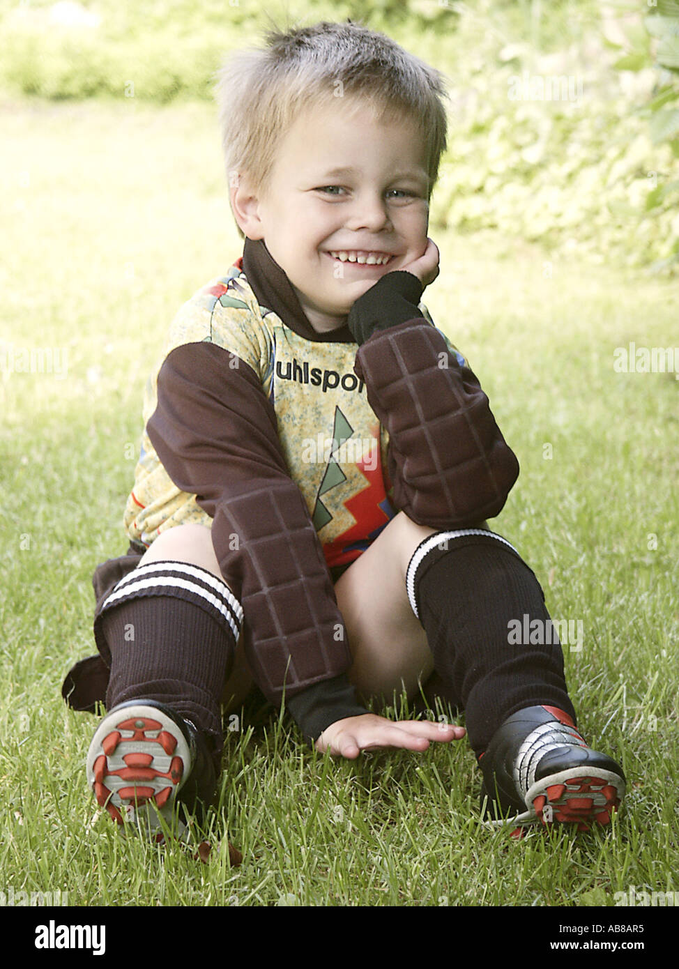 Portrait fair haired boy sitting hi-res stock photography and images ...