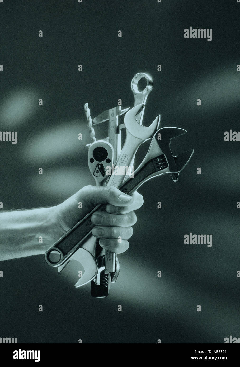 Man holding tools Stock Photo - Alamy