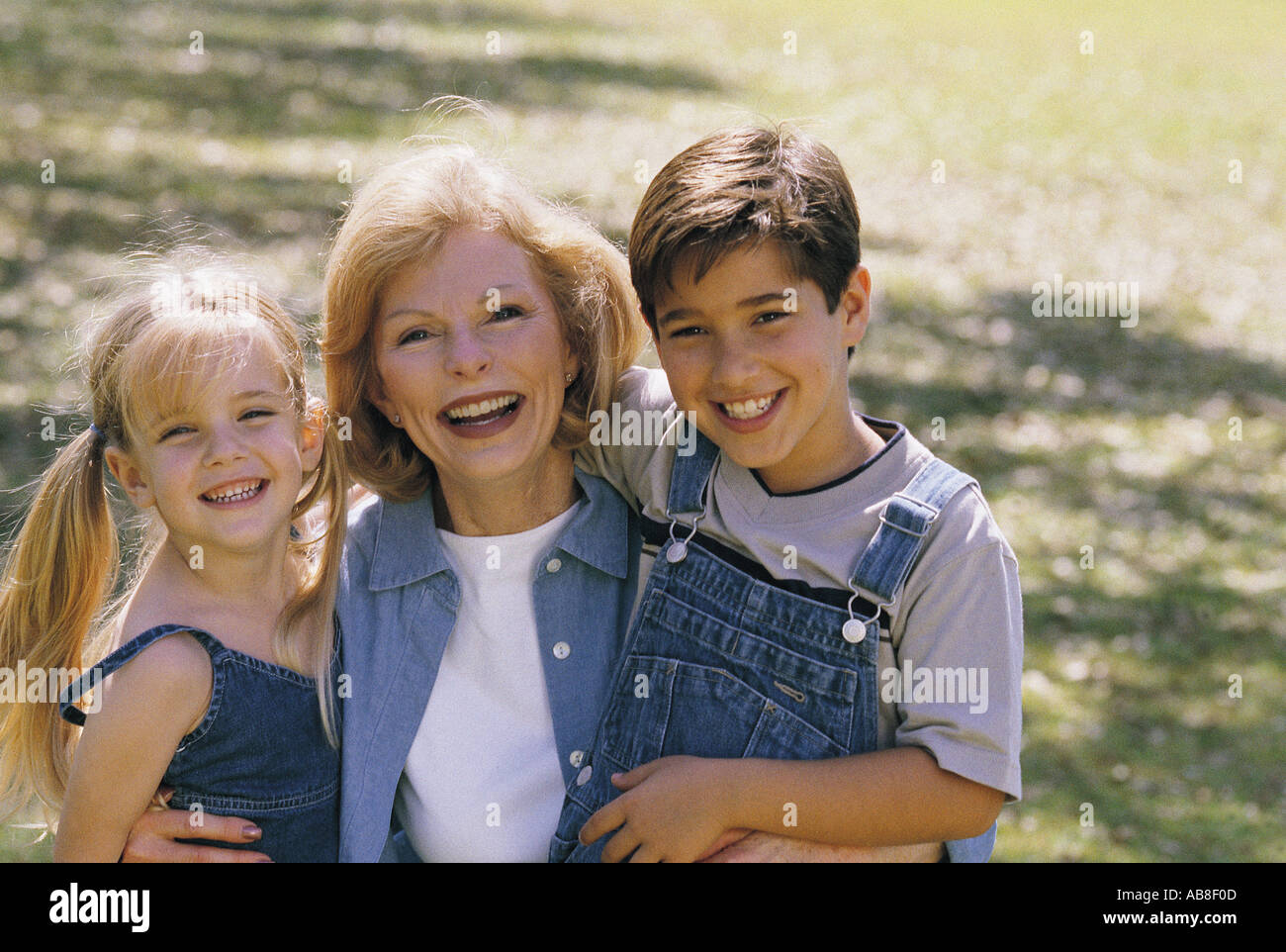 Mature woman and children Stock Photo - Alamy