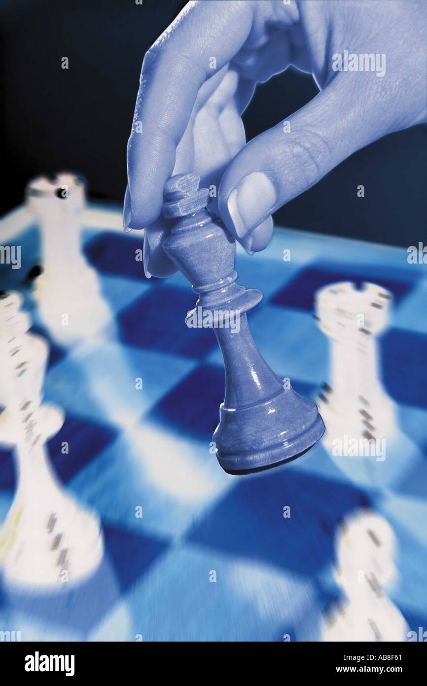 Woman moving chess piece hi-res stock photography and images - Alamy