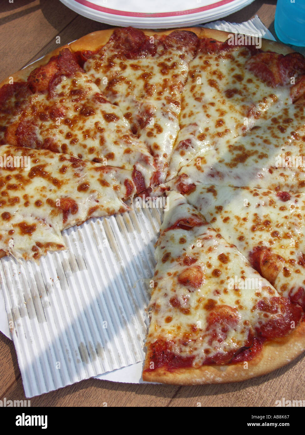 Pizza With A Piece Missing Stock Photo - Alamy