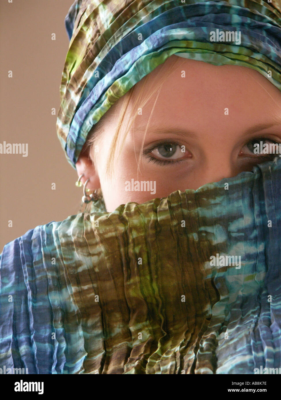 Young Girl with Scarf Covering Part of Face Stock Photo - Alamy