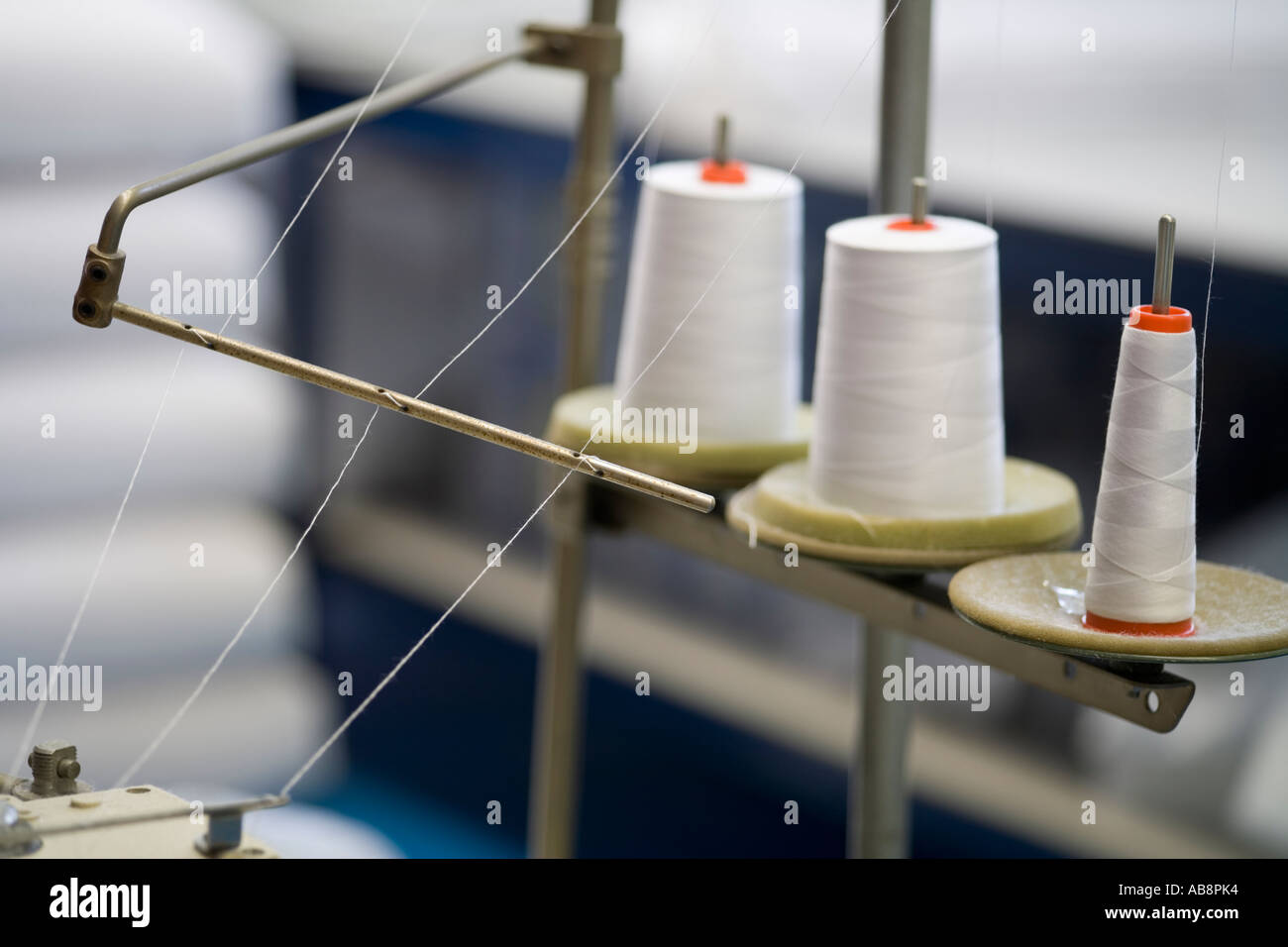 Detail of a industrial cutting and sewing machine with its cotton ...