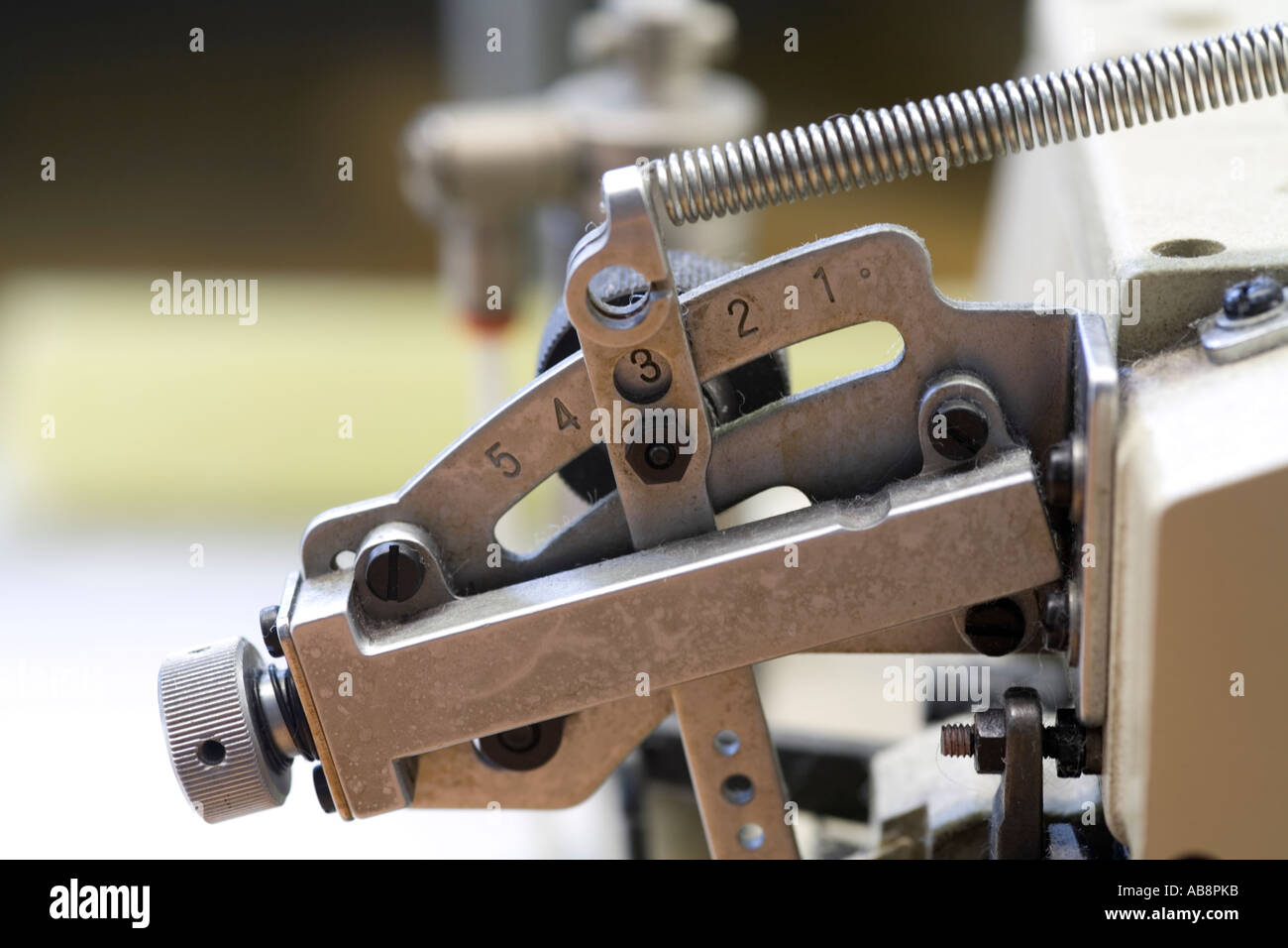 Detail of a industrial cutting and sewing machine Stock Photo - Alamy
