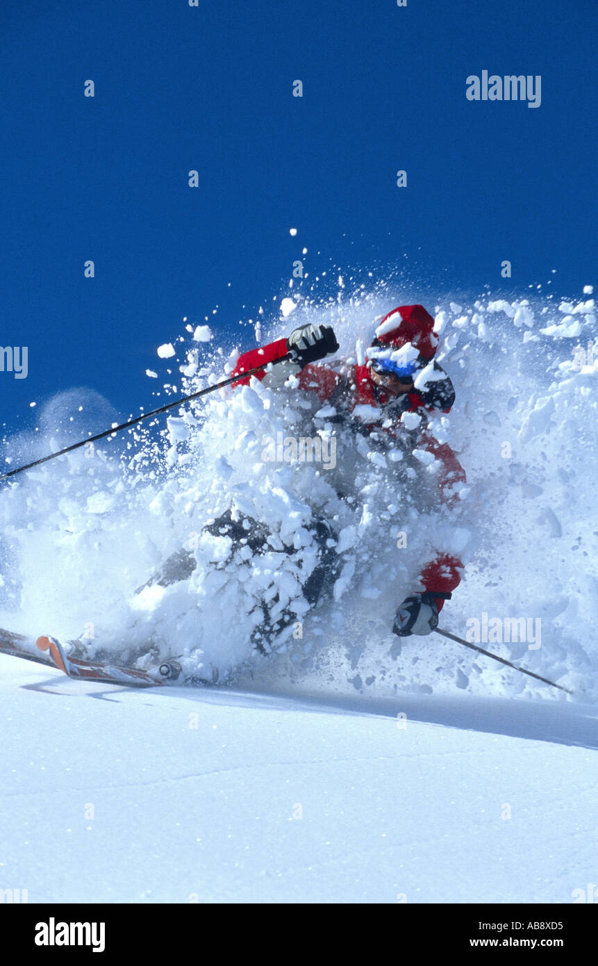 skier in a cloud of snow whirled up by himself Stock Photo - Alamy