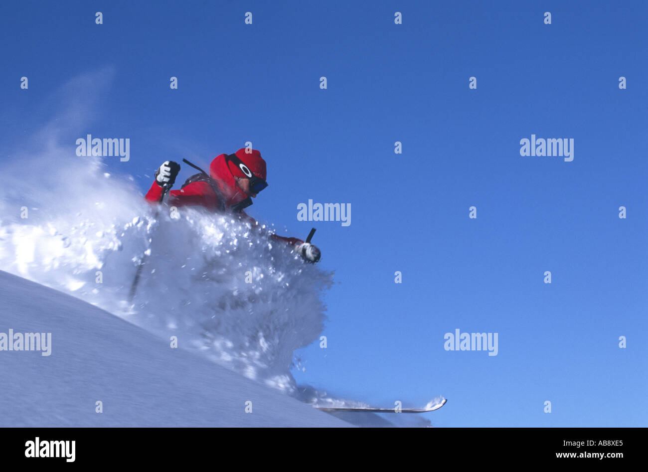 skier in a cloud of snow whirled up by himself Stock Photo - Alamy