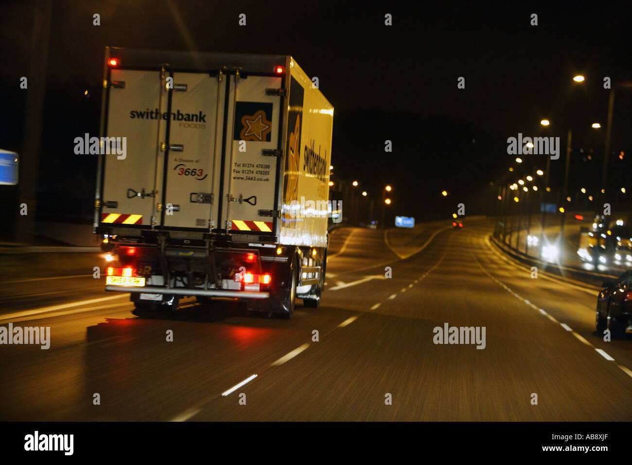 Traffic at night on motorway England Stock Photo - Alamy