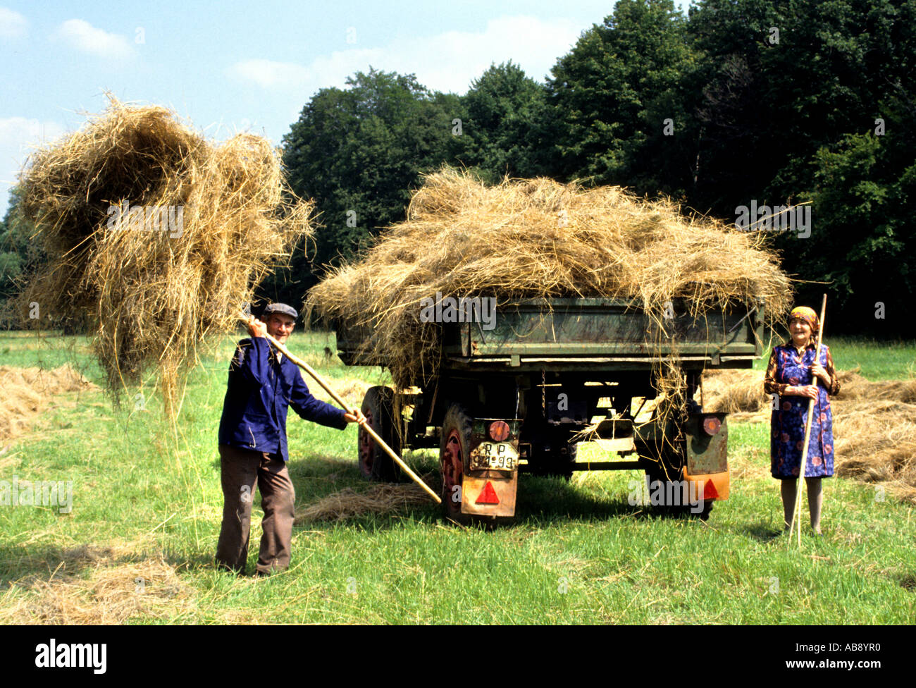 East 1985 Germany Farmers man woman Horsecart Stock Photo - Alamy