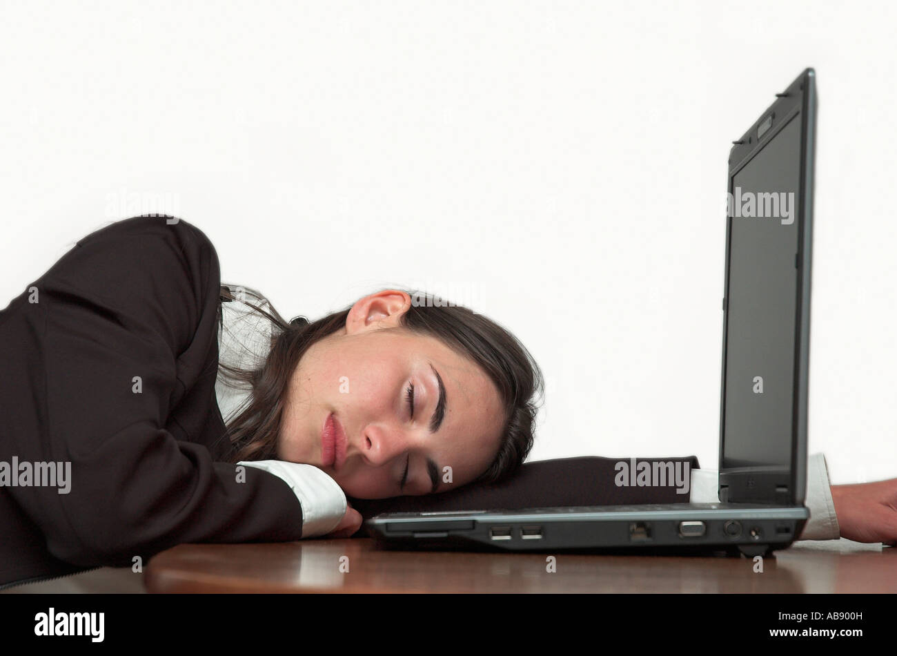 Young businesswoman sleeping at desk in office Stock Photo - Alamy