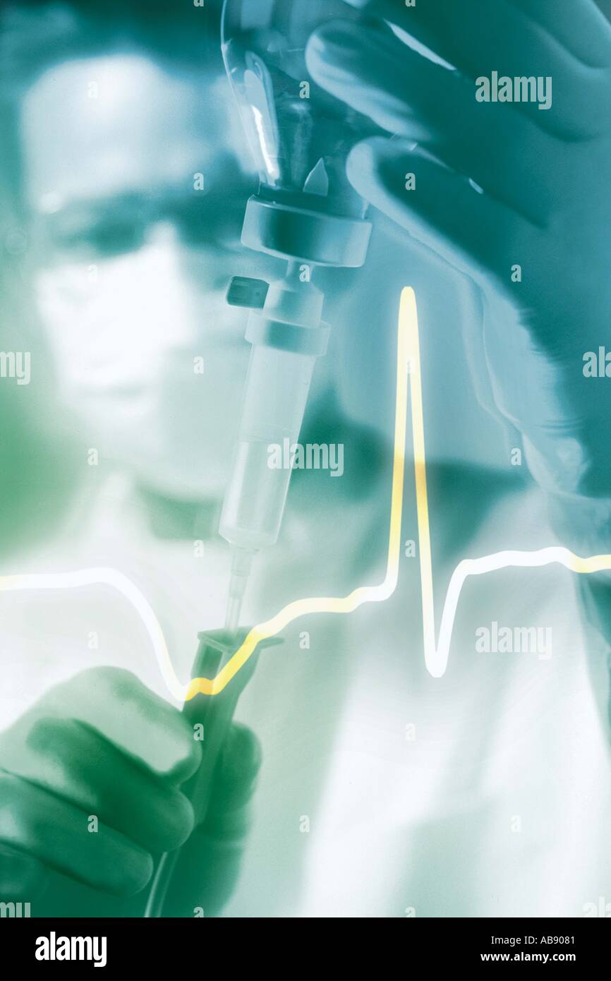 Nurse checking drip Stock Photo - Alamy