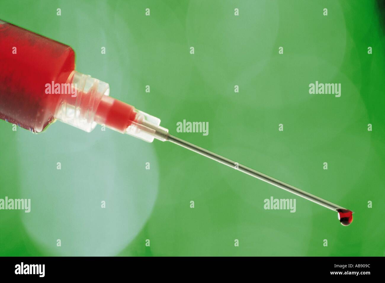 Syringe dripping blood hi-res stock photography and images - Alamy