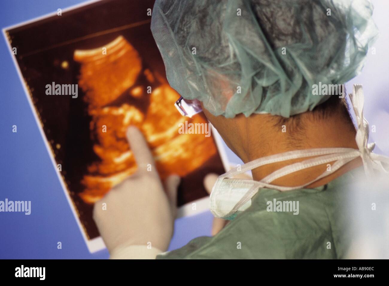 Surgeon checking scan Stock Photo - Alamy