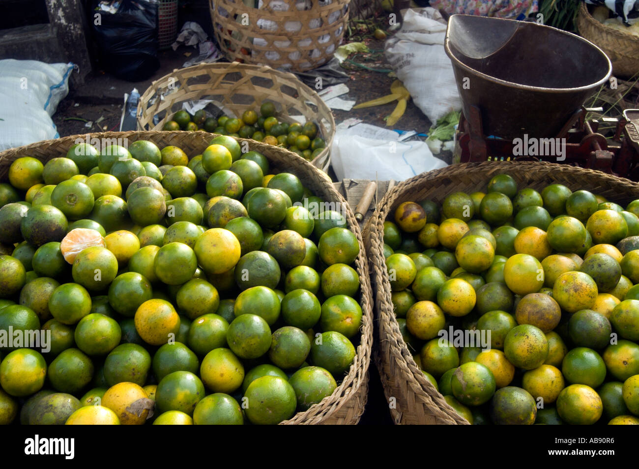 Yellow and green lemons and limes for sale in a market at bali ...