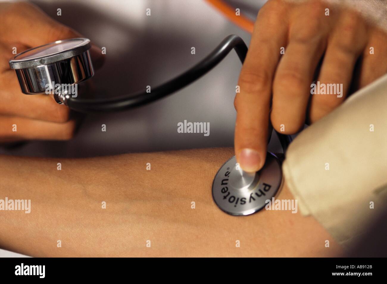 Checking blood pressure hi-res stock photography and images - Alamy