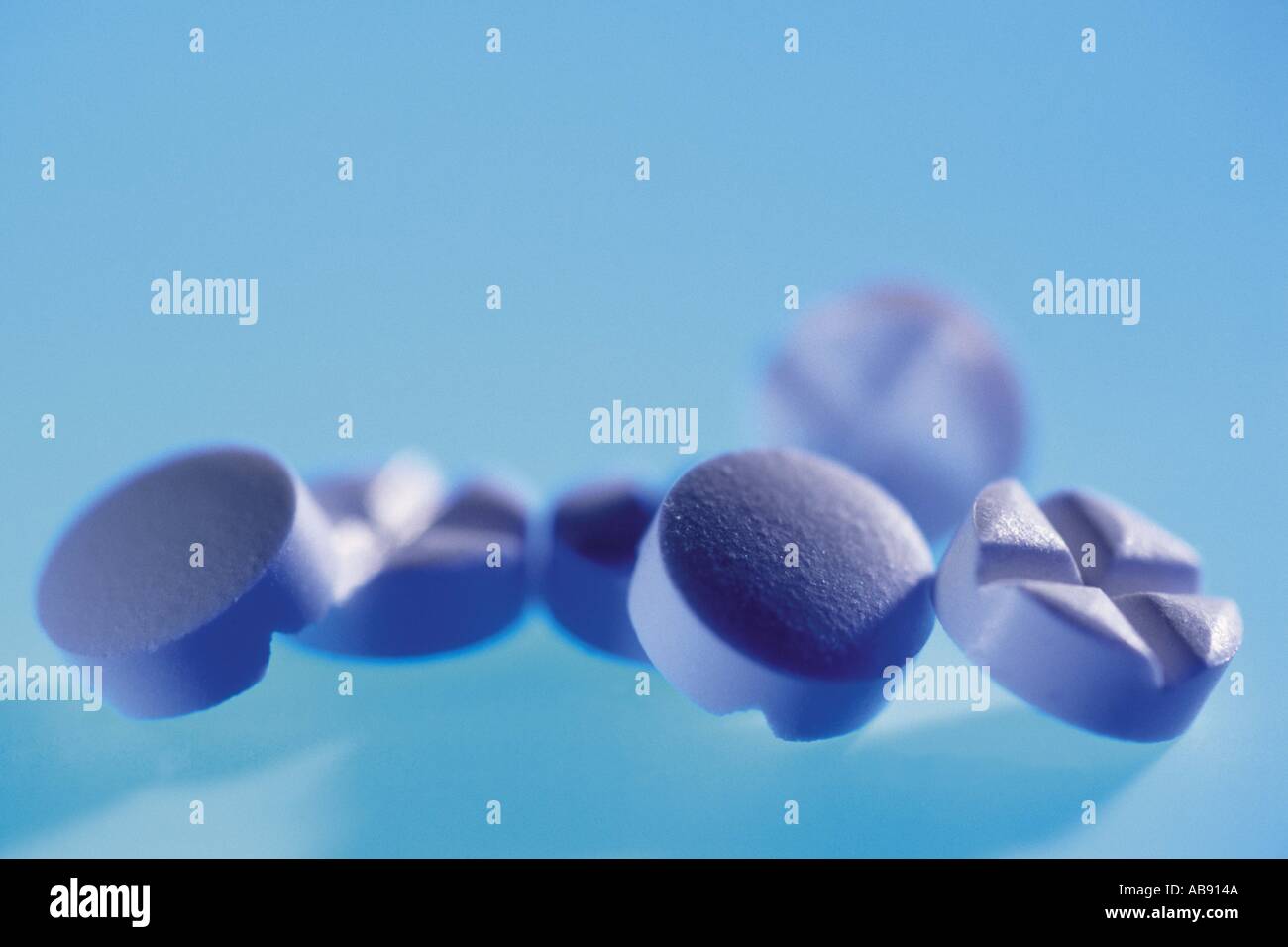 Blue tablets on background hi-res stock photography and images - Alamy