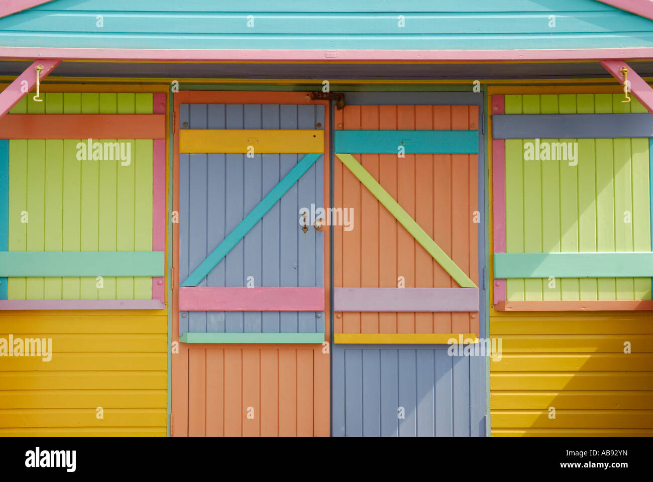 Close up of bright multi pastel coloured beach hut Whitstable Kent ...
