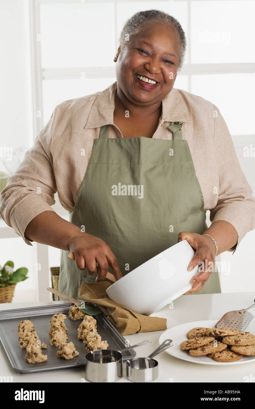 Senior black woman mixing baking hi-res stock photography and images ...