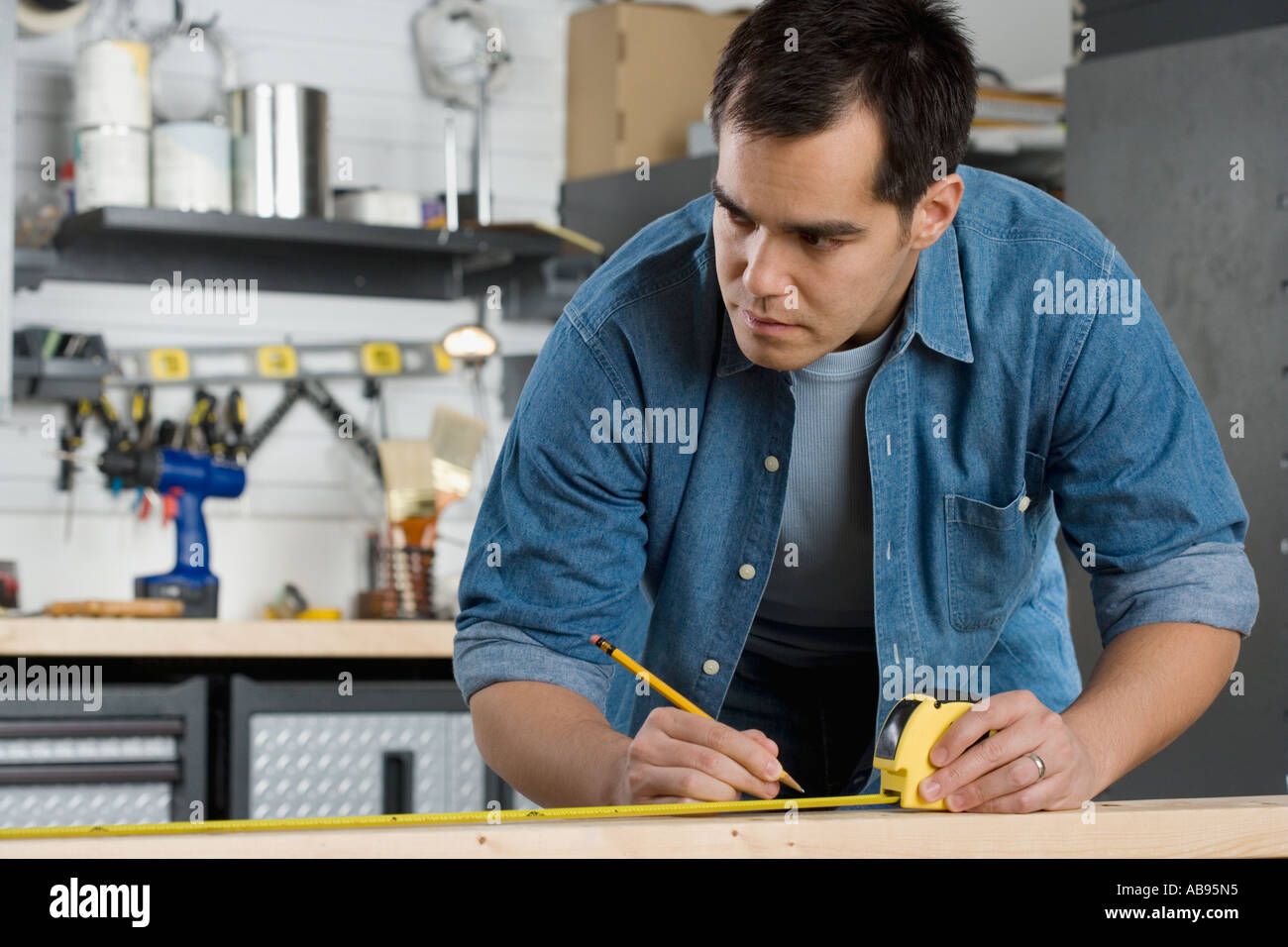 Carpenter making marks on wood Stock Photo - Alamy