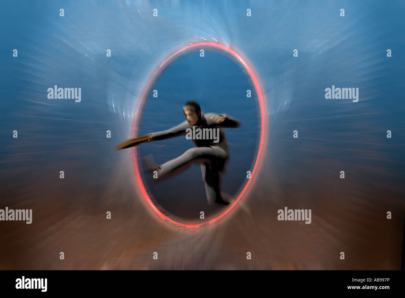 Business man jumping through a hoop Stock Photo - Alamy