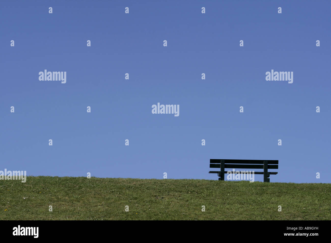 lonly bench on a dyke, Netherlands, Zeeland, Westkapelle Stock Photo ...