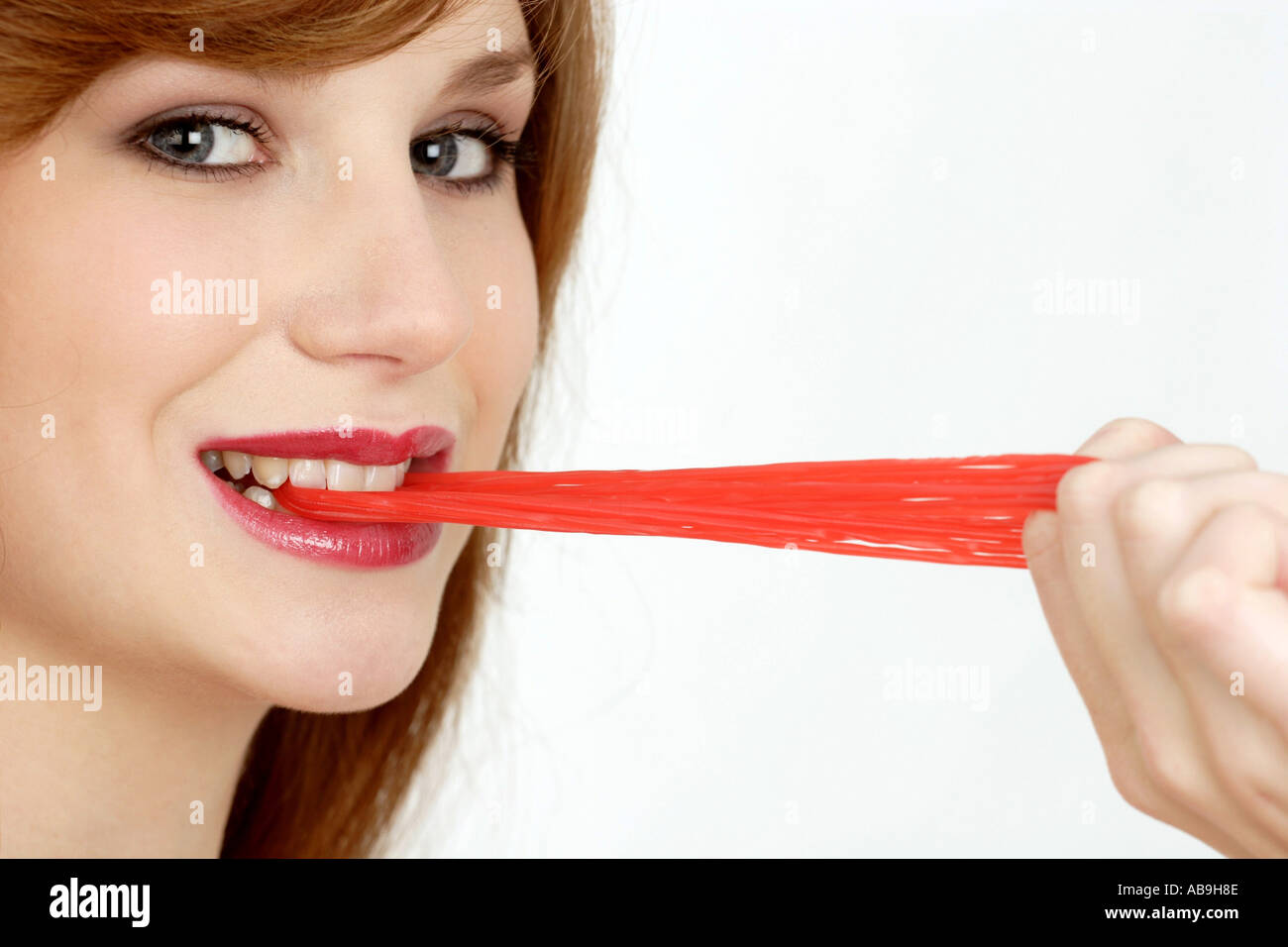 Woman biting on rubber hi-res stock photography and images - Alamy