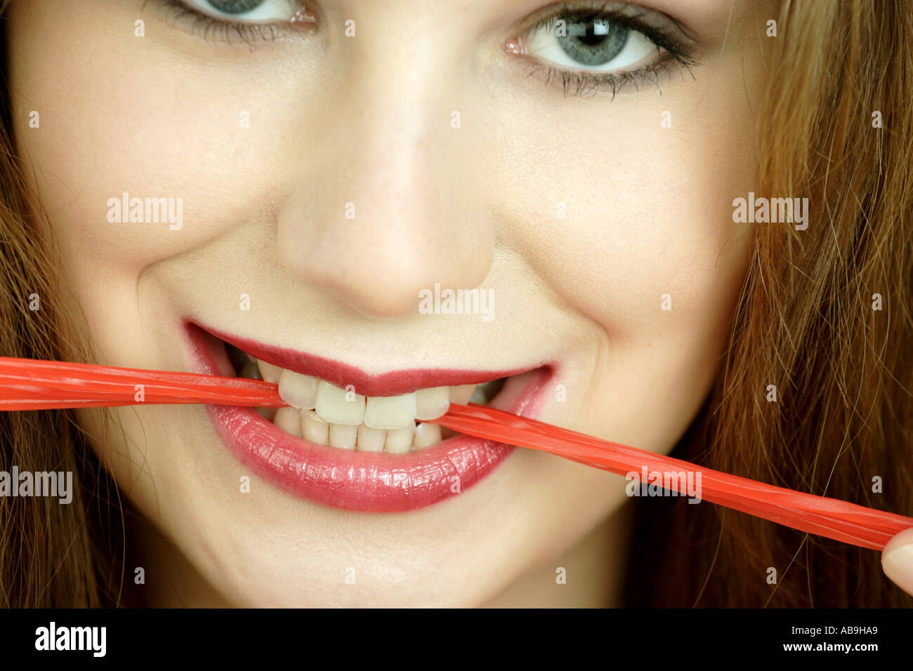 Woman biting on rubber hi-res stock photography and images - Alamy