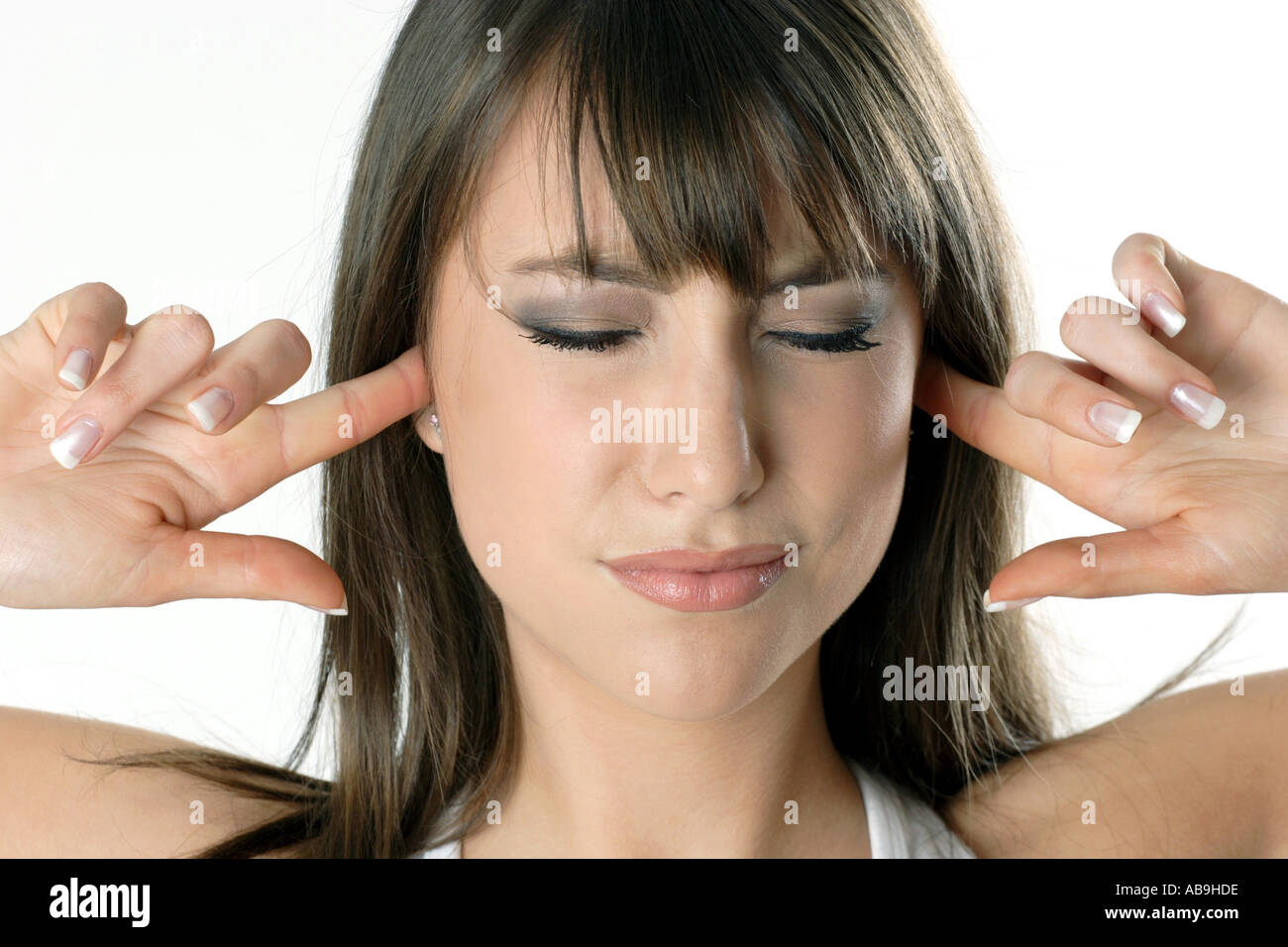 Woman putting fingers over her ears hi-res stock photography and images ...