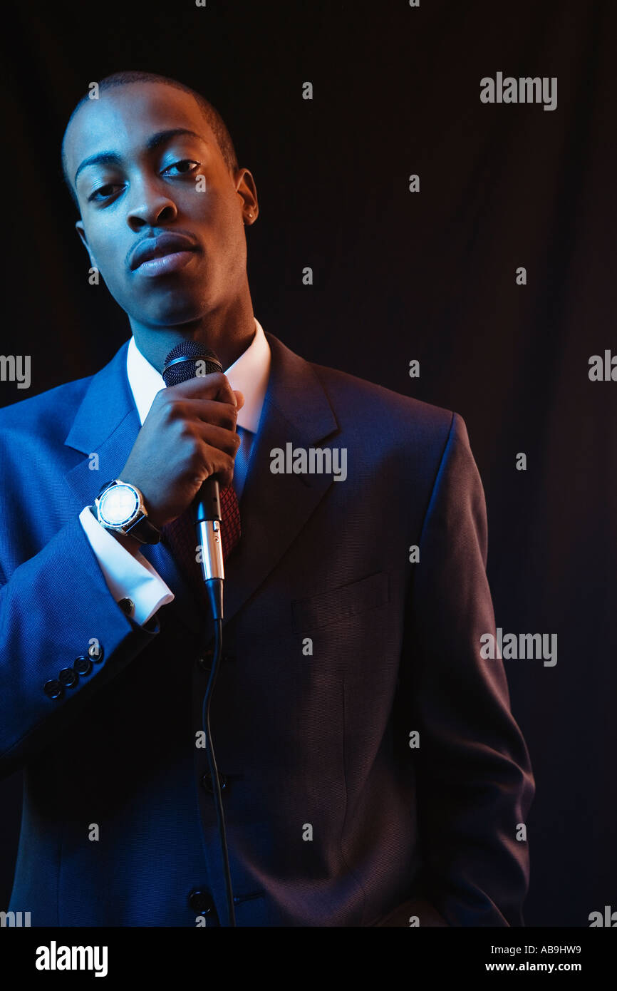 Speaking into a microphone hi-res stock photography and images - Alamy