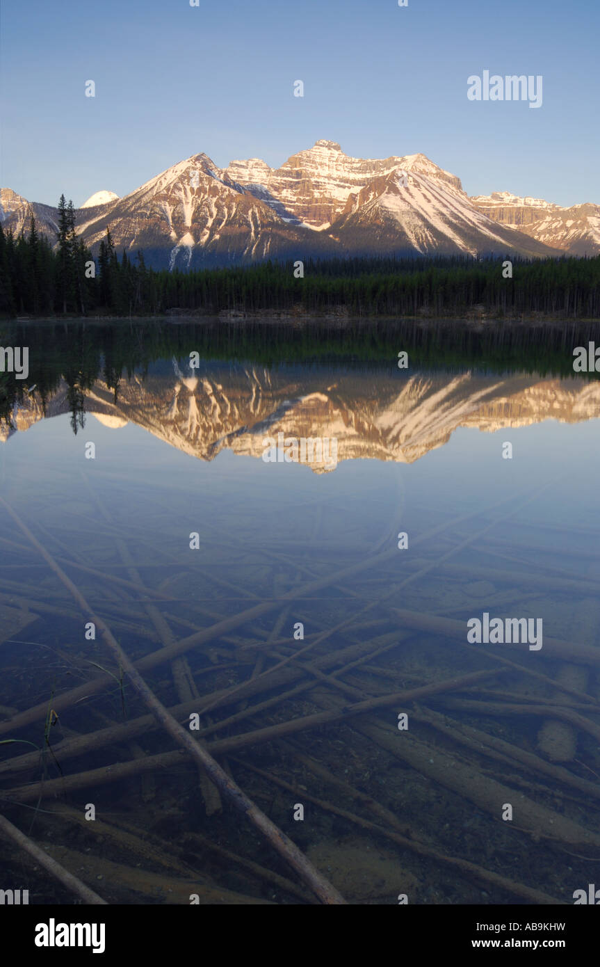 Sunrise on the Bow Range and crystal clear Herbert Lake Banff National ...