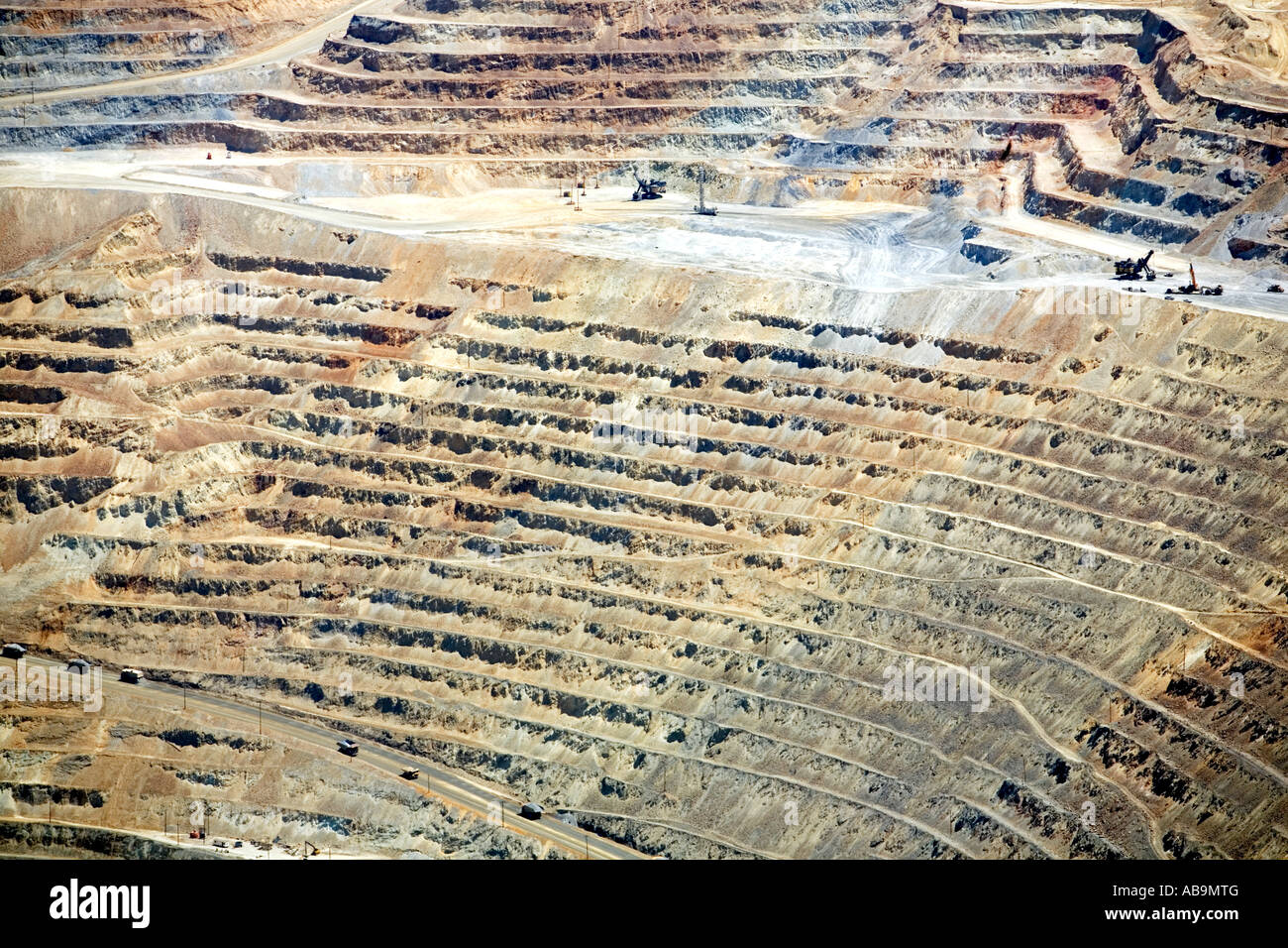 Kennecott mine site trucks and scoops deep inside open pit mine. View ...