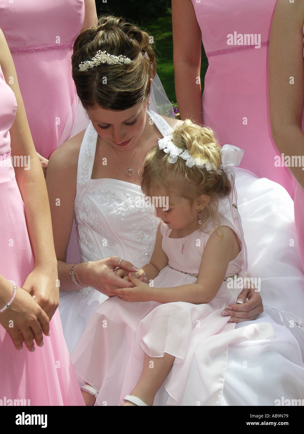 Flower Girl Sitting on Brides Lap Stock Photo - Alamy