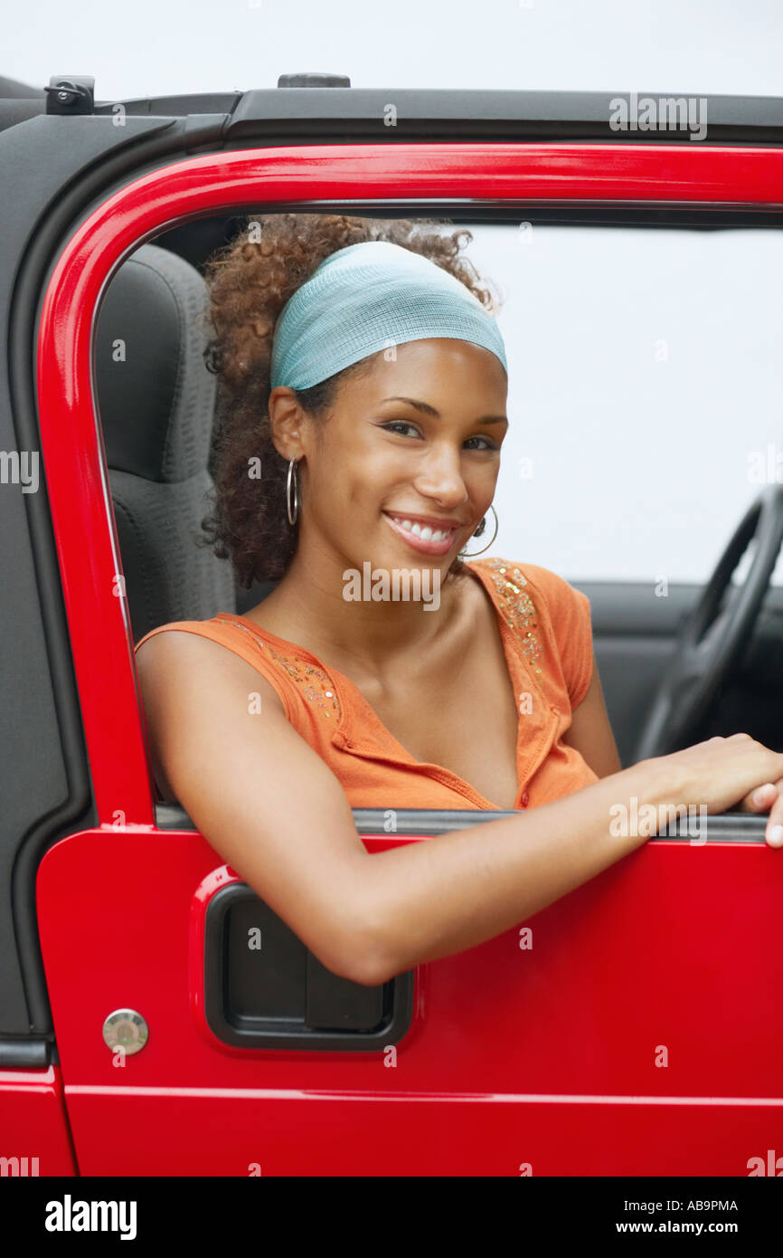 Young woman riding in a Jeep Stock Photo - Alamy