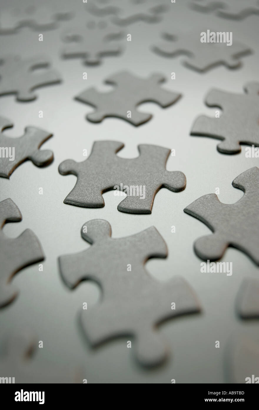 silver jigsaw puzzle pieces Stock Photo - Alamy