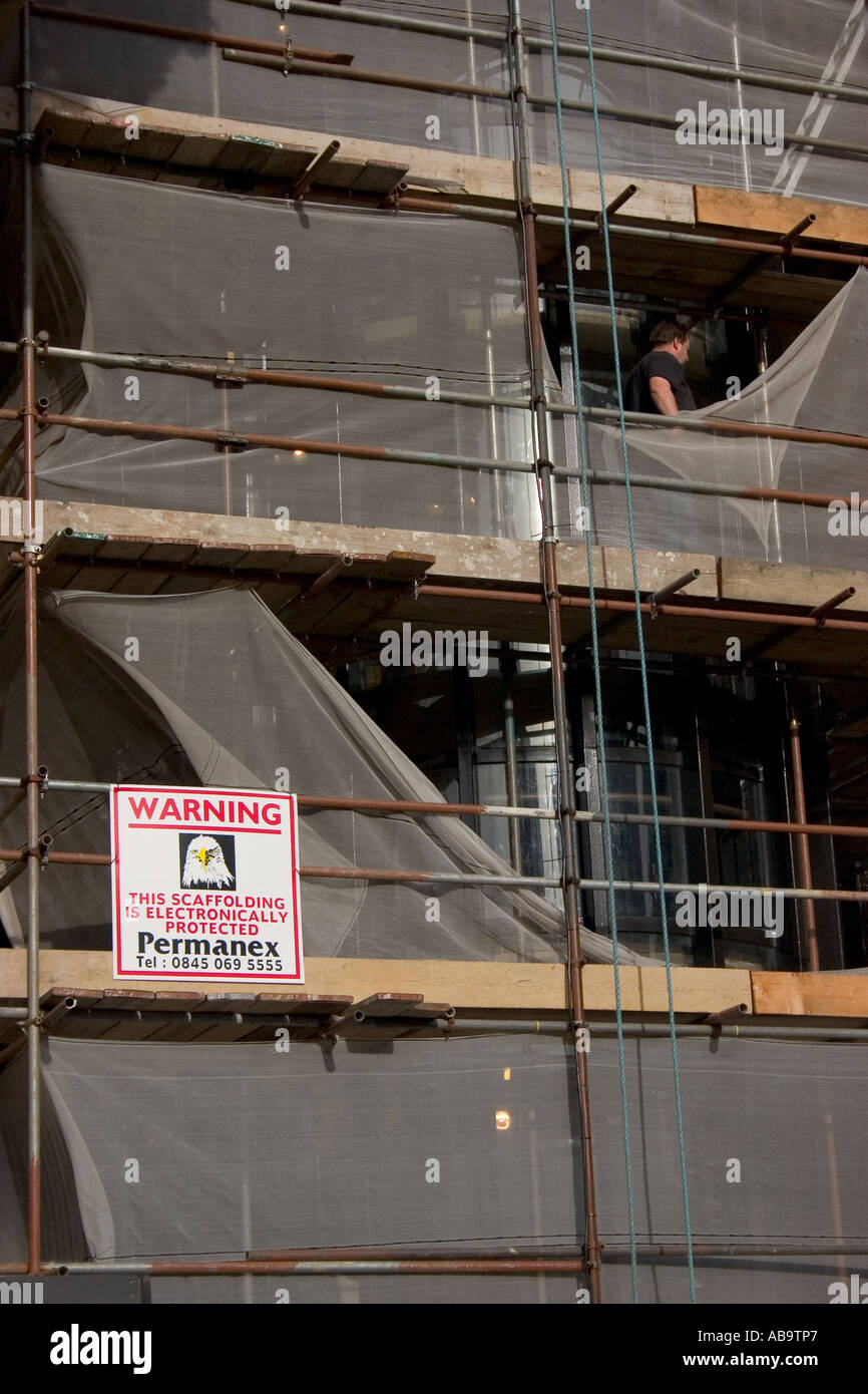 Security sign upon scaffolding at Barbican Centre London Stock Photo ...