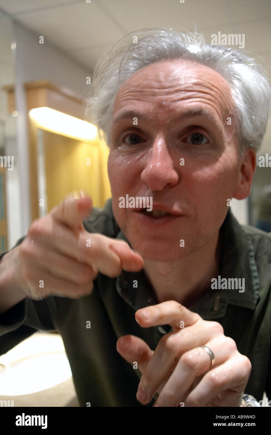 mad looking man in forties pointing at camera Stock Photo - Alamy