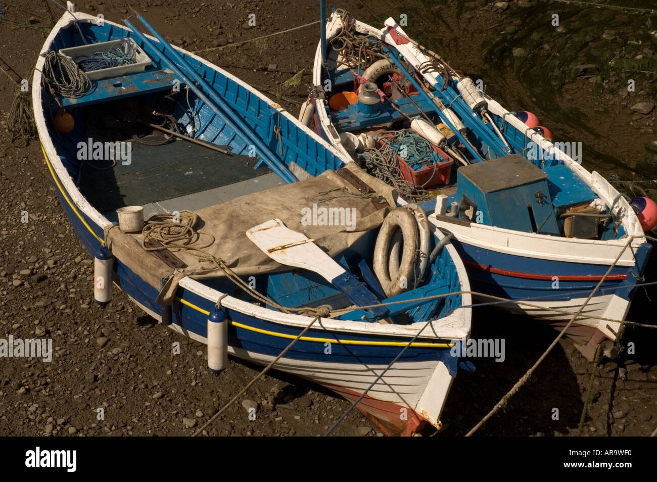 Traditional coble fishing boats in the beck at Staithes North Yorkshire ...