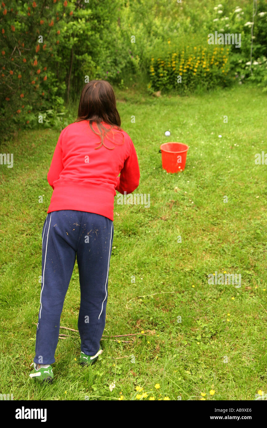 Competition for fun Throwing a golf ball into a plastic bucket Stock ...