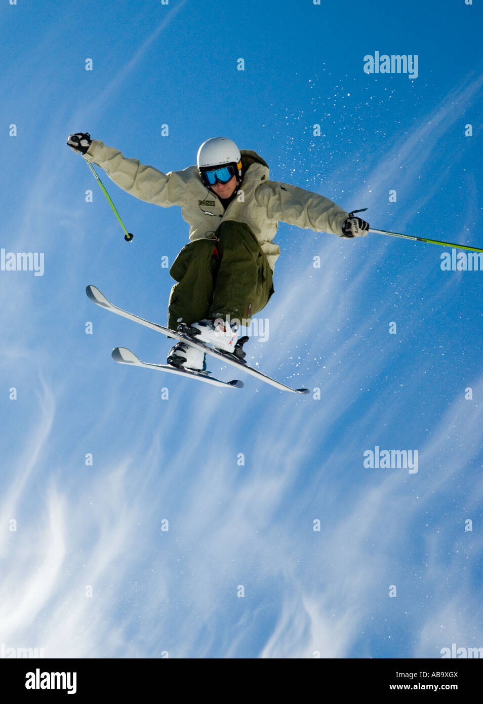 Idaho A skier flies high on a beautiful blue sky day with dramatic ...