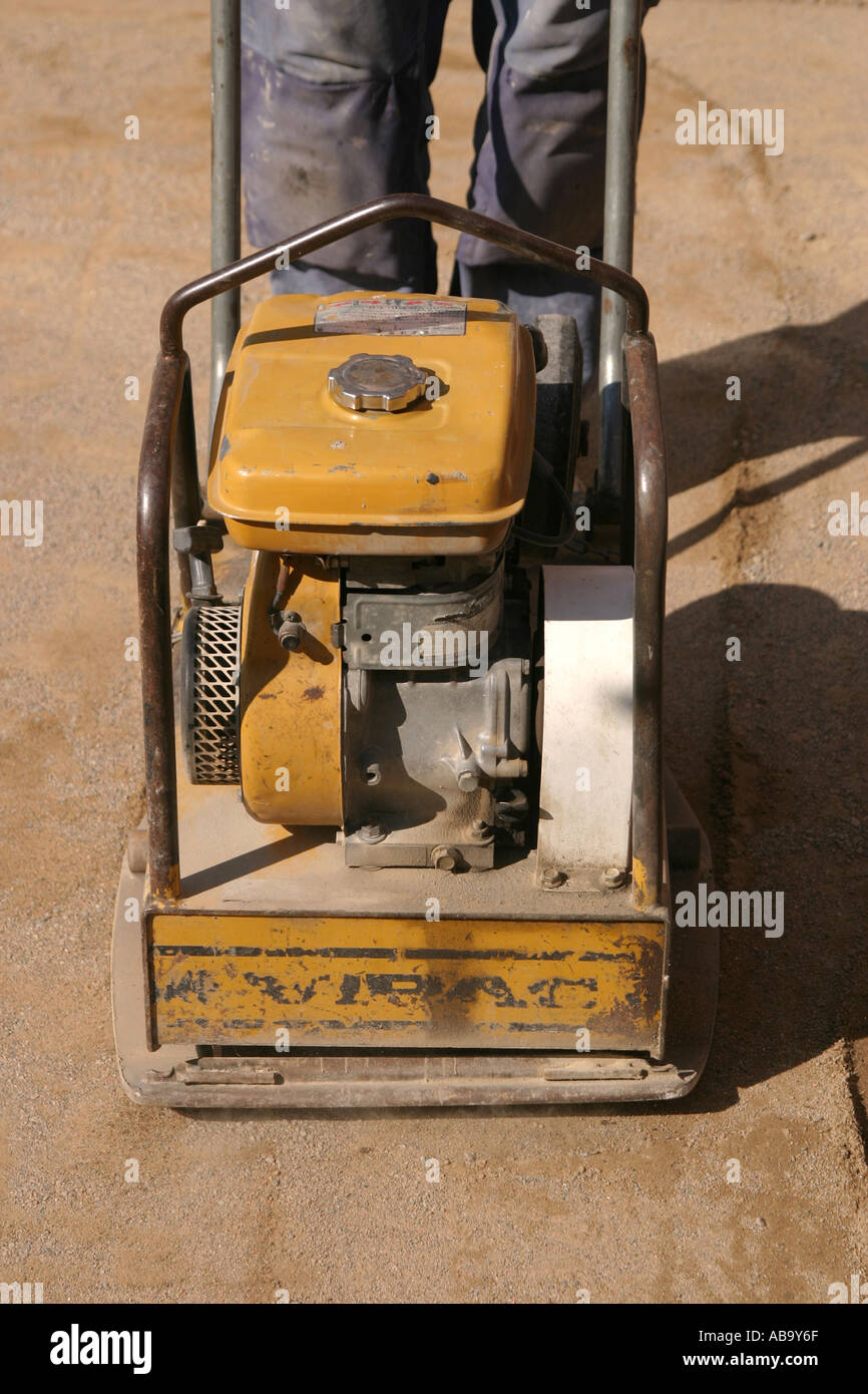 Packing sand with a machine Stock Photo - Alamy